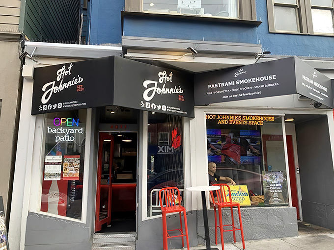 Hot Johnnie's modest storefront belies the flavor explosion waiting inside. Those bright red chairs are like beacons calling to sandwich lovers everywhere.