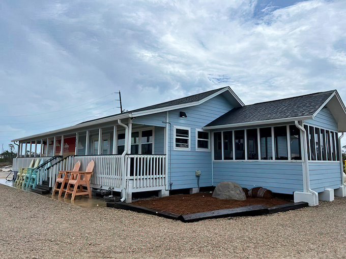 The coastal charm of LongBill's welcomes you with pastel Adirondack chairs and a laid-back porch that practically whispers, "Slow down, you're on beach time now."