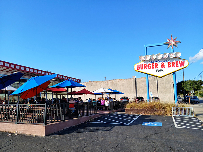 Colorful umbrellas dot the outdoor dining space at Boulevard Burger & Brew, offering a perfect spot for enjoying Richmond's pleasant weather.