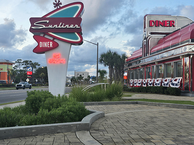 The iconic Sunliner Diner sign beckons with mid-century charm and a neon promise of "Hot Biscuits" that's impossible to resist.