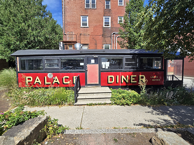 The iconic red exterior of Palace Diner stands like a beacon of breakfast hope in Biddeford. This vintage dining car promises culinary treasures within its compact frame.