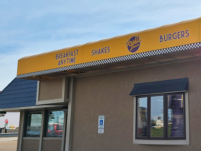 Kroll's iconic yellow awning promises "Breakfast Anytime" &ndash; a beacon of hope for hungry North Dakotans seeking omelet perfection.