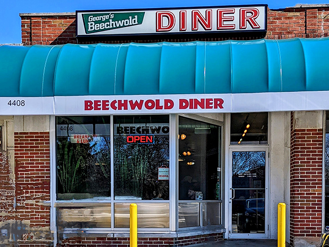 That turquoise awning isn't just a splash of color&mdash;it's a time portal to an era when conversations happened face-to-face and comfort food actually comforted.