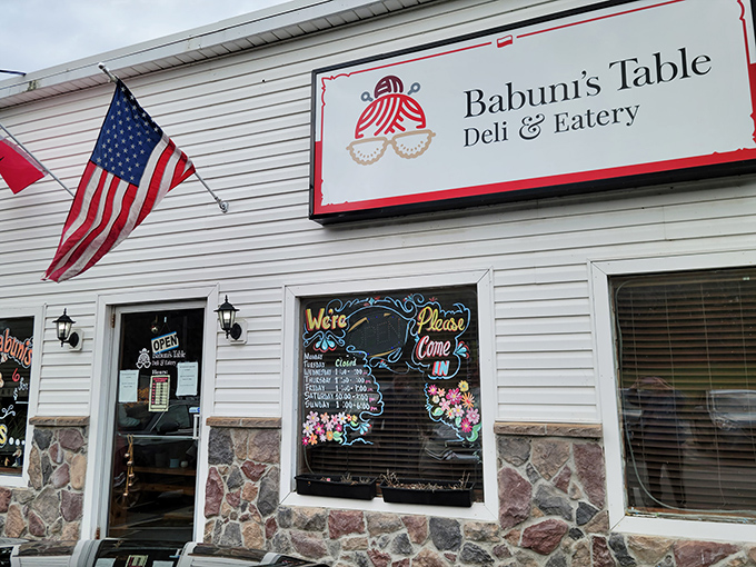 The stone facade and cheerful signage practically shout "come eat" before you've even parked the car.