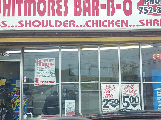 The iconic storefront of Whitmore's Bar-B-Q proudly announces its smoky treasures&mdash;no fancy frills needed when the food speaks this loudly.