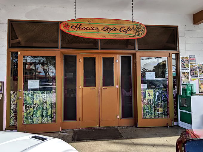 The surfboard sign says it all – this isn't some fancy tourist trap, but a slice of authentic Hawaii where flavor trumps frills.