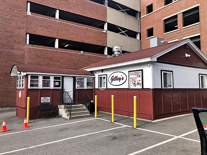 Nestled against a parking garage, this unassuming diner proves that culinary greatness often comes in small, red packages.