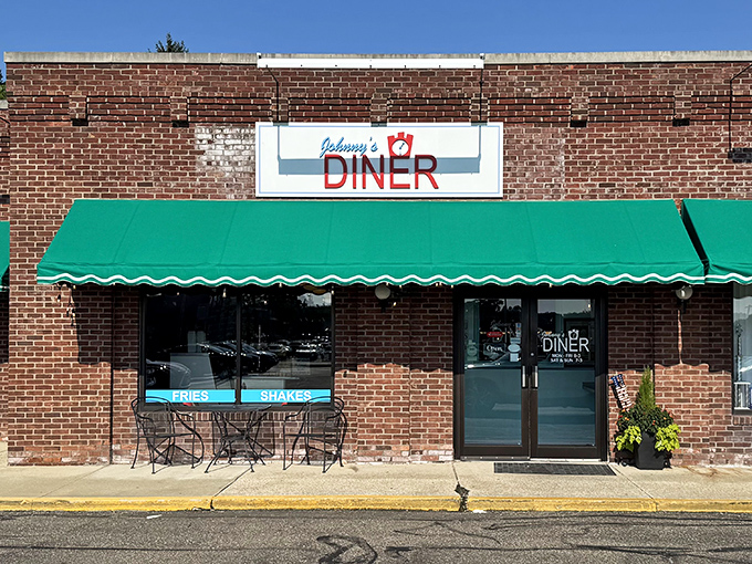 The unassuming brick exterior of Johnny's Diner hides breakfast treasures that would make your grandmother proud. That green awning is basically a beacon of hope for hungry travelers.