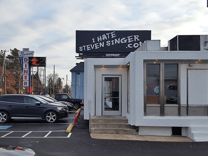 The unmistakable neon "DINER" sign stands tall against the Pennsylvania sky, guiding food pilgrims to this Upper Darby Township institution.