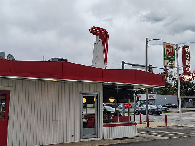The iconic red and turquoise exterior of Bobo's stands like a time capsule on Topeka's 10th Avenue, complete with vintage neon signage that's been beckoning hungry travelers for generations.
