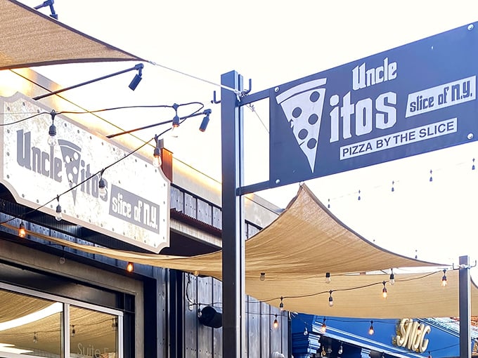 The unmistakable signage of Uncle Vito's beckons pizza pilgrims with its promise of New York-style slices under Sacramento's golden sunshine.