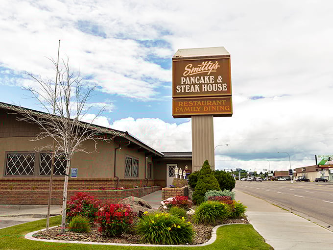 The iconic brown sign stands like a beacon of breakfast hope, promising pancake paradise to hungry Idaho Falls residents since before Instagram made food famous.