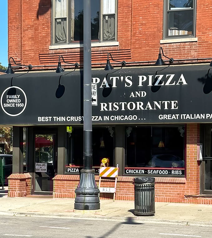 The iconic black awning of Pat's Pizza & Ristorante stands as a beacon of culinary constancy in a sea of trendy Chicago eateries.