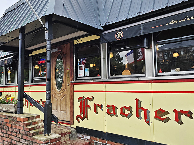 The classic yellow exterior with "Fracher's" signage and American flags announces you've arrived somewhere with history, not just breakfast.
