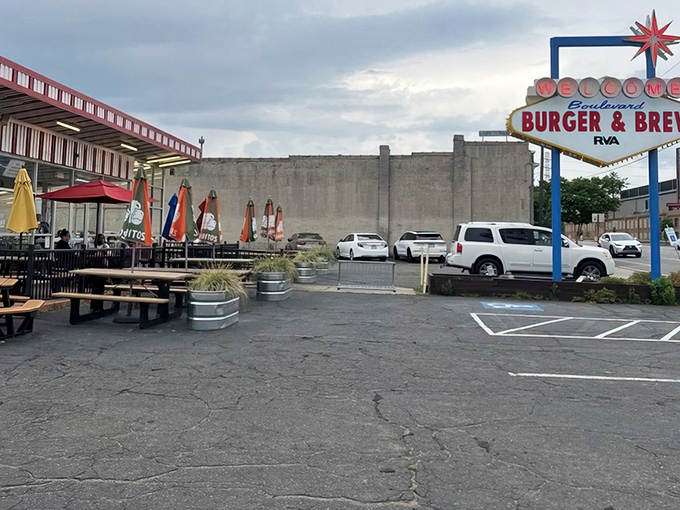 The iconic mid-century modern sign of Boulevard Burger & Brew beckons hungry visitors to its vibrant patio seating area.