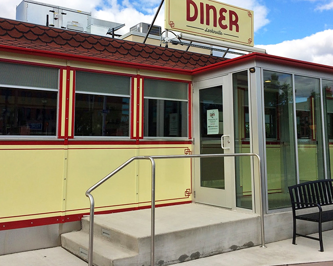 The gleaming yellow exterior of Swan Street Diner beckons like a time machine disguised as a lunch counter. Those red trim details aren't just decorative&mdash;they're practically winking at you.