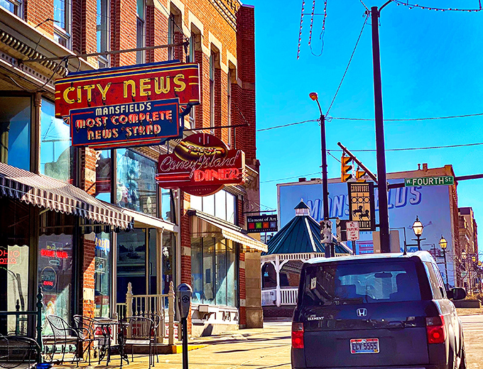 The iconic neon sign beckons like a lighthouse for hungry souls navigating downtown Mansfield. Some treasures don't need fancy packaging.