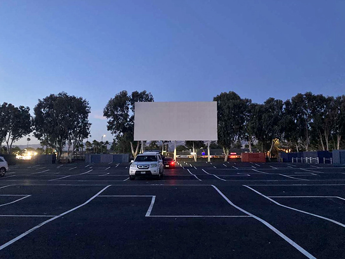 The magic hour at West Wind Capitol Drive-In, where nostalgia meets modern entertainment under California's expansive sky. Movie memories in the making.