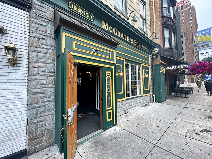 The emerald facade of McGrath's Pub stands proudly on Locust Street, its gold trim and wooden door promising Irish hospitality in the heart of Pennsylvania's capital.