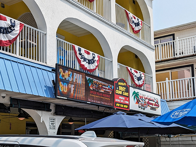 Patriotic bunting and a bold sign proclaiming "World's Best Crab Cake" welcome you to this unassuming coastal treasure. Beach casual meets culinary excellence.
