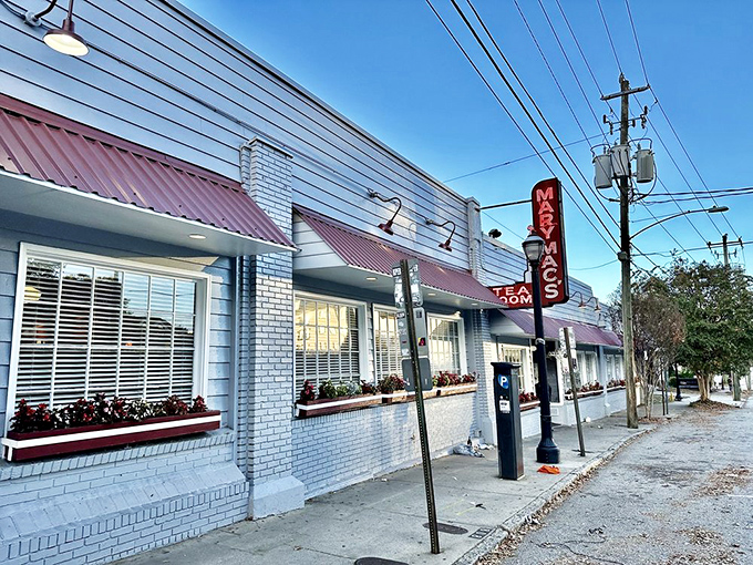 The iconic red neon sign of Mary Mac's Tea Room glows like a beacon of Southern comfort against the Atlanta skyline. Culinary pilgrimage site? Absolutely.