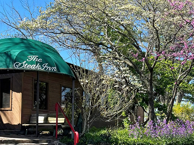 The Steak Inn welcomes you with rustic charm and blooming dogwoods, like nature's own welcome committee for your taste buds.