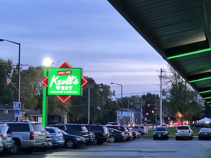 The iconic green and red Kroll's West sign stands proudly against a blue Wisconsin sky, beckoning hungry Packers fans and comfort food enthusiasts alike.