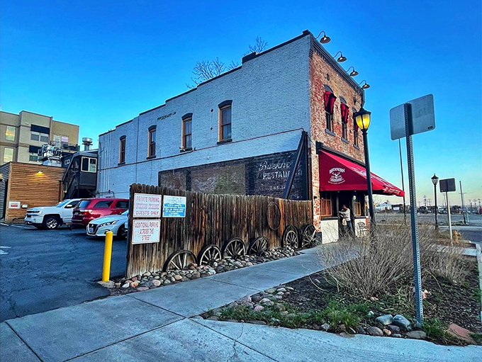 From another angle, this historic building reveals its no-nonsense Western character&mdash;where wagon wheels meet modern wheels in a timeless Colorado tableau.