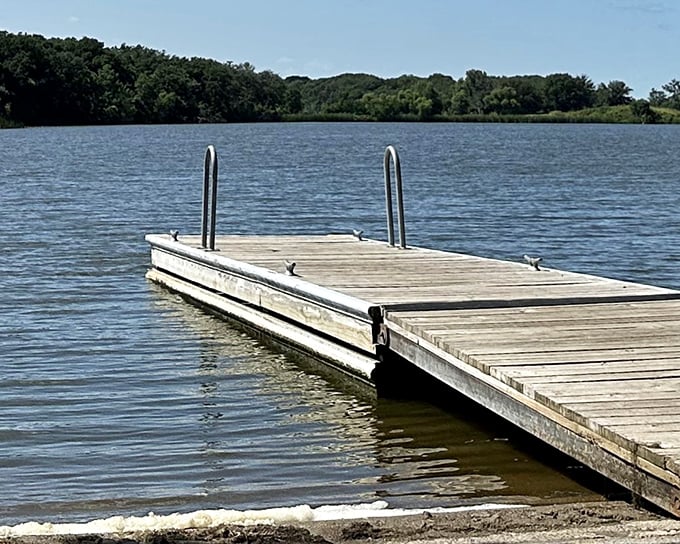 A wooden dock stretches into the serene waters of Oakwood Lakes like an invitation to adventure. Nature's front porch awaits your arrival.