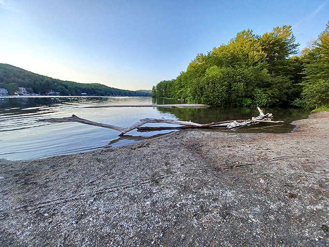 Dawn breaks over Lake St. Catherine with the gentleness of an old friend's greeting. The still waters mirror the surrounding hills, creating nature's perfect symmetry.