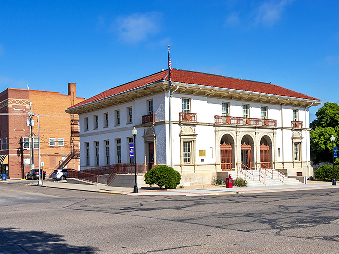 The La Junta Municipal Building stands like a dignified elder statesman of architecture, its white façade and red-tiled roof a refreshing departure from modern glass boxes.