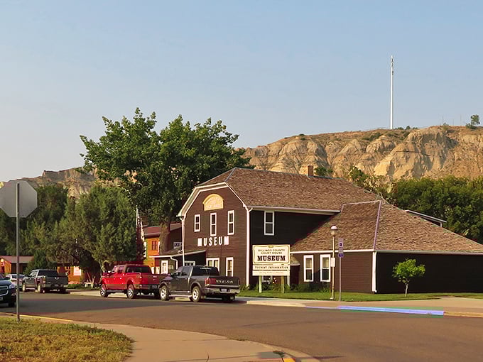The North Dakota Museum that tells Medora's story sits beneath golden buttes like a history book waiting to be opened.