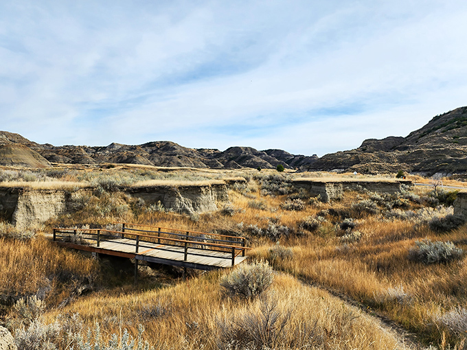 The winding road through Makoshika's badlands feels like driving into a painting where time forgot to keep moving forward.