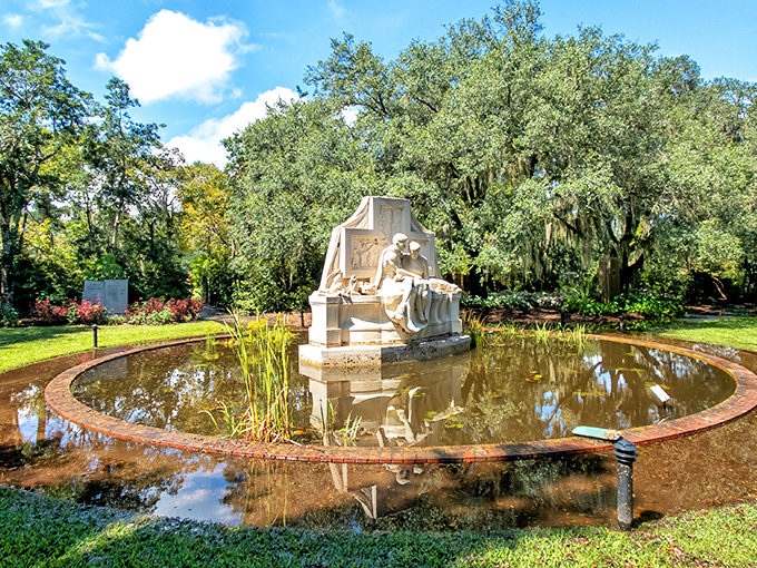 A moment of serenity captured in stone. This reflective sculpture creates its own peaceful universe amid the lush greenery of Brookgreen Gardens.