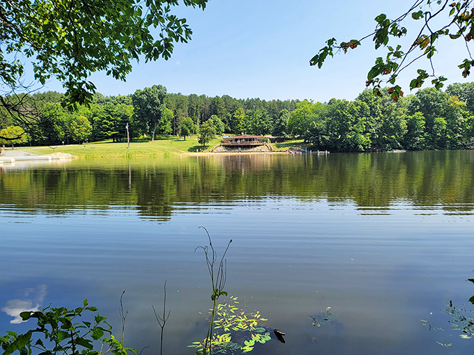Cutler Lake shimmers like nature's mirror, reflecting towering trees and cloud-dotted skies. The perfect spot for contemplation or catching tomorrow's dinner.
