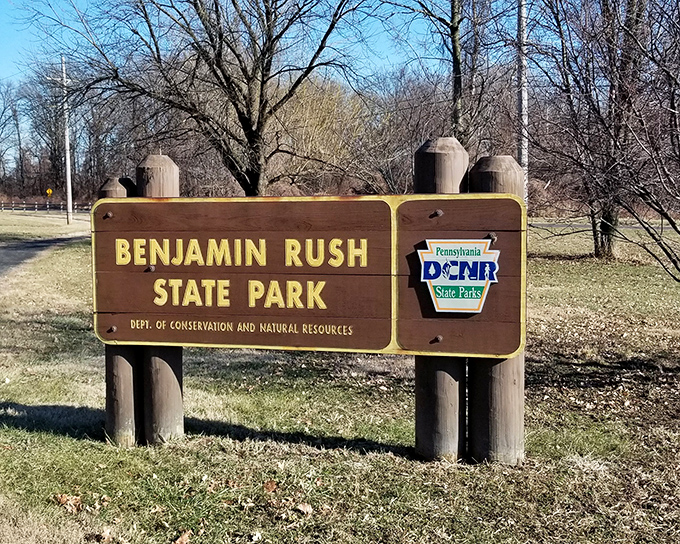 The official welcome sign stands sentinel at the park entrance, like a friendly ma&icirc;tre d' inviting you into Philadelphia's natural dining room.