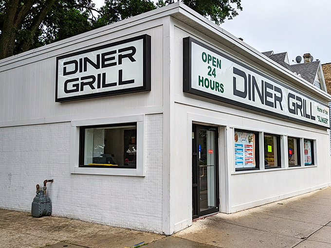 The white box of culinary dreams stands proudly on Irving Park Road, its "OPEN 24 HOURS" sign a beacon for hungry night owls and early birds alike.