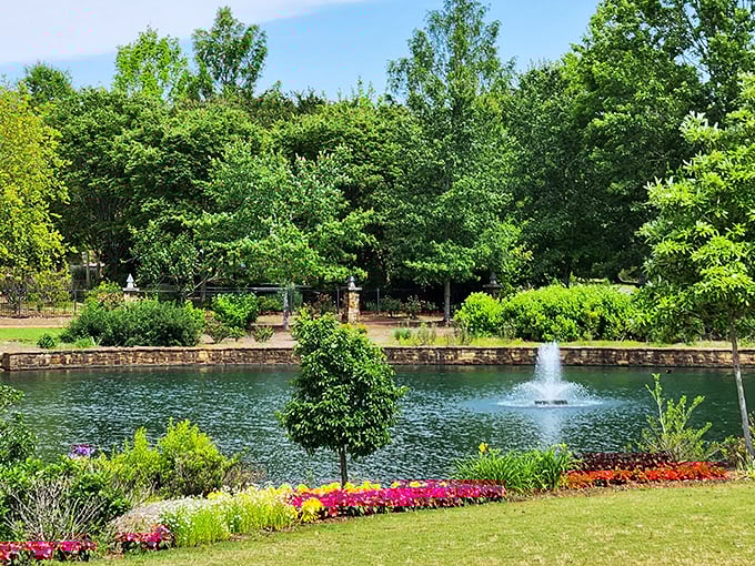 A serene pond reflects the sky like nature's mirror, while vibrant flowers create a colorful border that would make any stress melt away faster than ice cream in August.