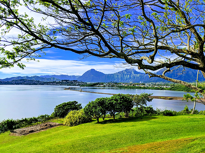 Mountains carved by time meet waters shaped by tradition in a view that makes problems feel microscopic.