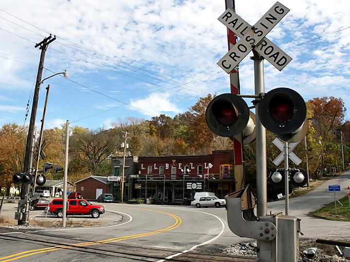 The iconic railroad crossing signals stand sentinel at Makanda's entrance, where time seems to slow down the moment you arrive.