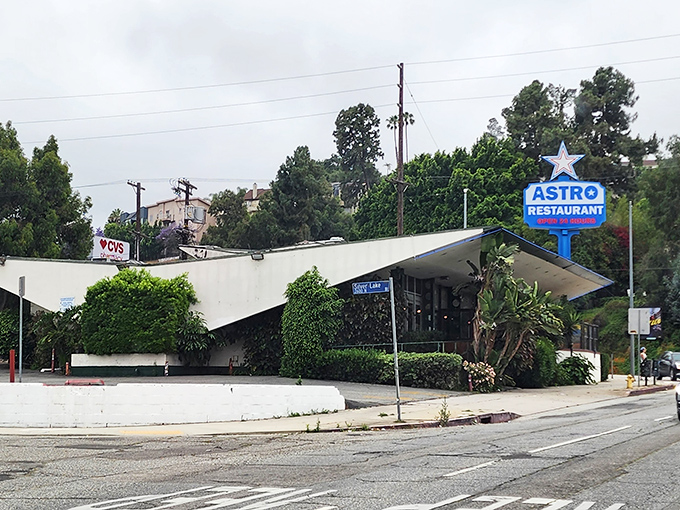 The iconic Googie architecture of Astro Family Restaurant stands like a mid-century time capsule in Silver Lake, complete with that unmistakable star-topped blue sign.