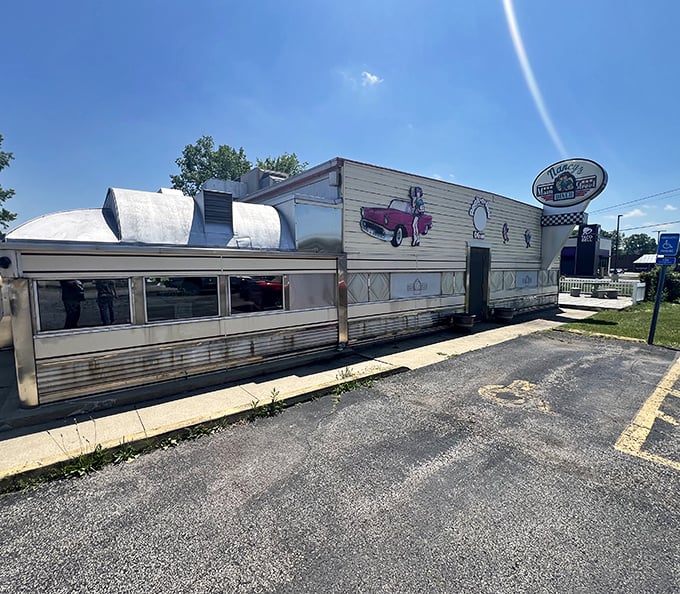 
The classic silver exterior of Nancy's Main Street Diner gleams in the Ohio sunshine, a chrome time capsule promising comfort food and nostalgia by the plateful. 