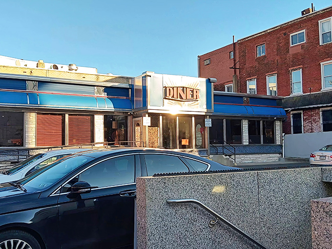 That iconic blue-and-white facade practically glows with the promise of breakfast perfection waiting inside for hungry souls.