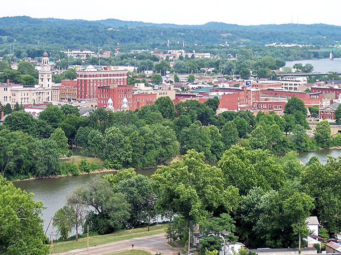 Marietta's skyline unfolds like a storybook illustration, where red brick buildings and church spires rise above the lush riverbanks of the Muskingum.