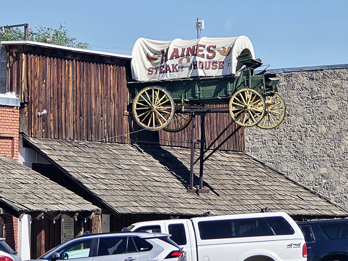 That covered wagon sign isn't just decoration &ndash; it's a promise of frontier-sized portions ahead.