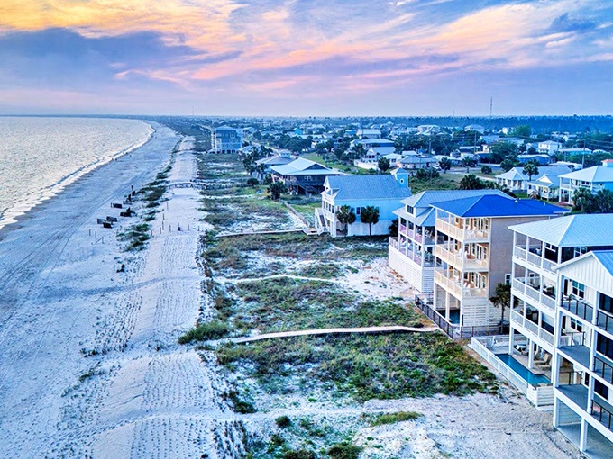 Sunset paints Port St. Joe's coastline in watercolor hues, where beachfront homes stand like sentinels guarding the secret of affordable Florida paradise.