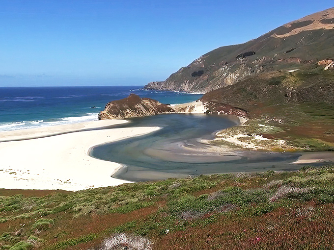 Nature's perfect composition unfolds at Seal Beach Overlook, where river meets ocean in a swirling dance that would make even the most jaded traveler gasp.