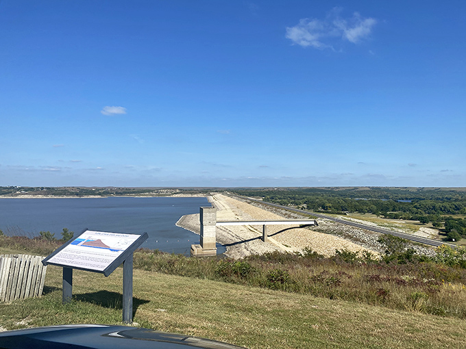The massive Tuttle Creek Dam stretches across the landscape like nature's Great Wall, only this one holds back enough water to make a fish feel like it's won the lottery.