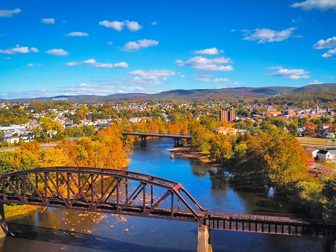 Autumn paints Connellsville in gold and crimson, with the Youghiogheny River flowing beneath historic bridges. Small-town charm with million-dollar views that don't require a millionaire's budget.