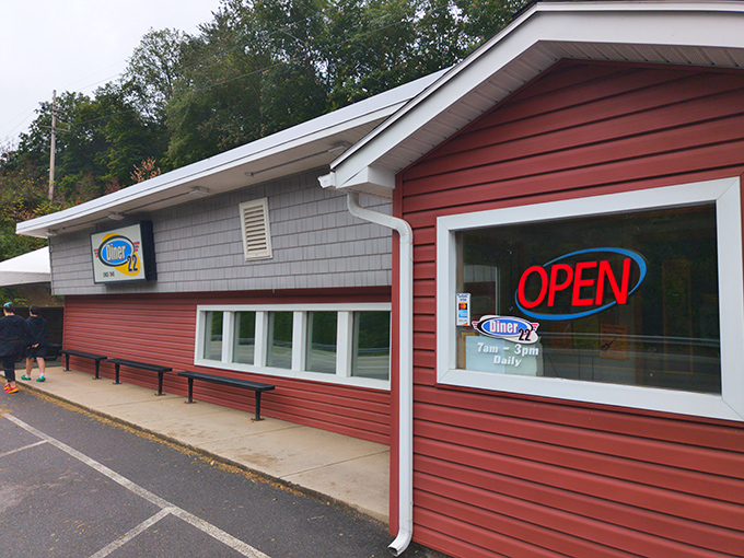 That neon "OPEN" sign isn't just an invitation&mdash;it's a promise of the small-town hospitality waiting inside this roadside haven.